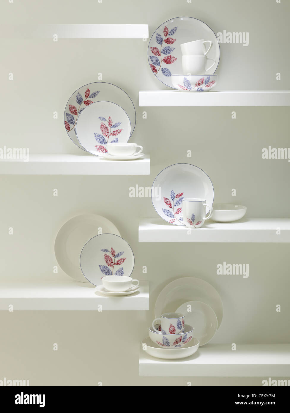 A still life shot of a display of crockery on shelves Stock Photo - Alamy
