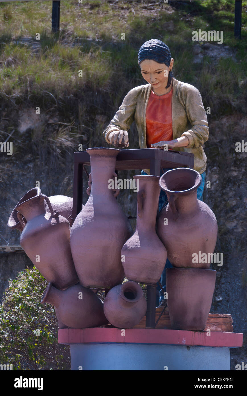 A statue dedicated to Ecuadorian potters has a woman creating a piece ...