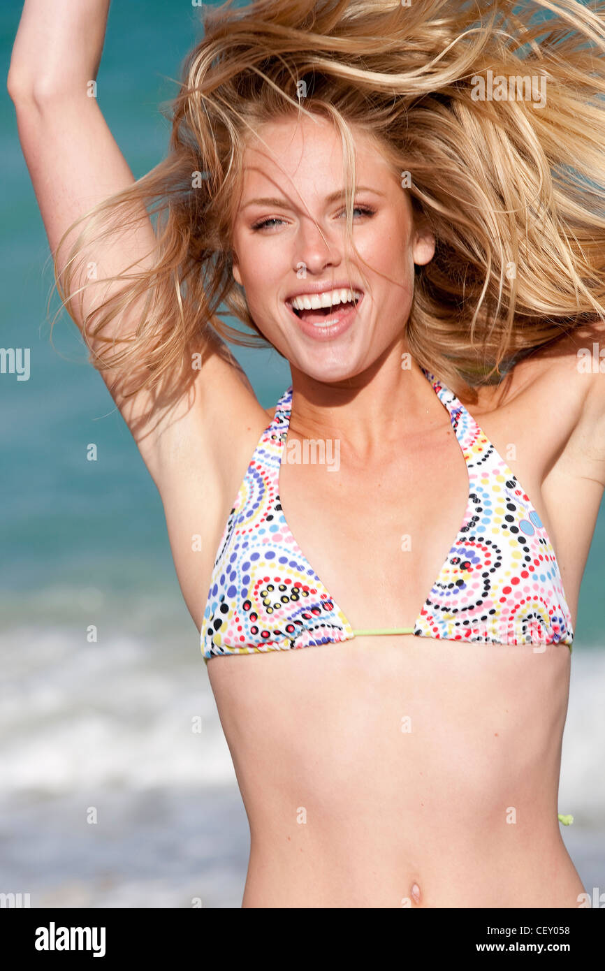 Female Long Straight Blonde Hair Wearing Colourful Bikini Standing On