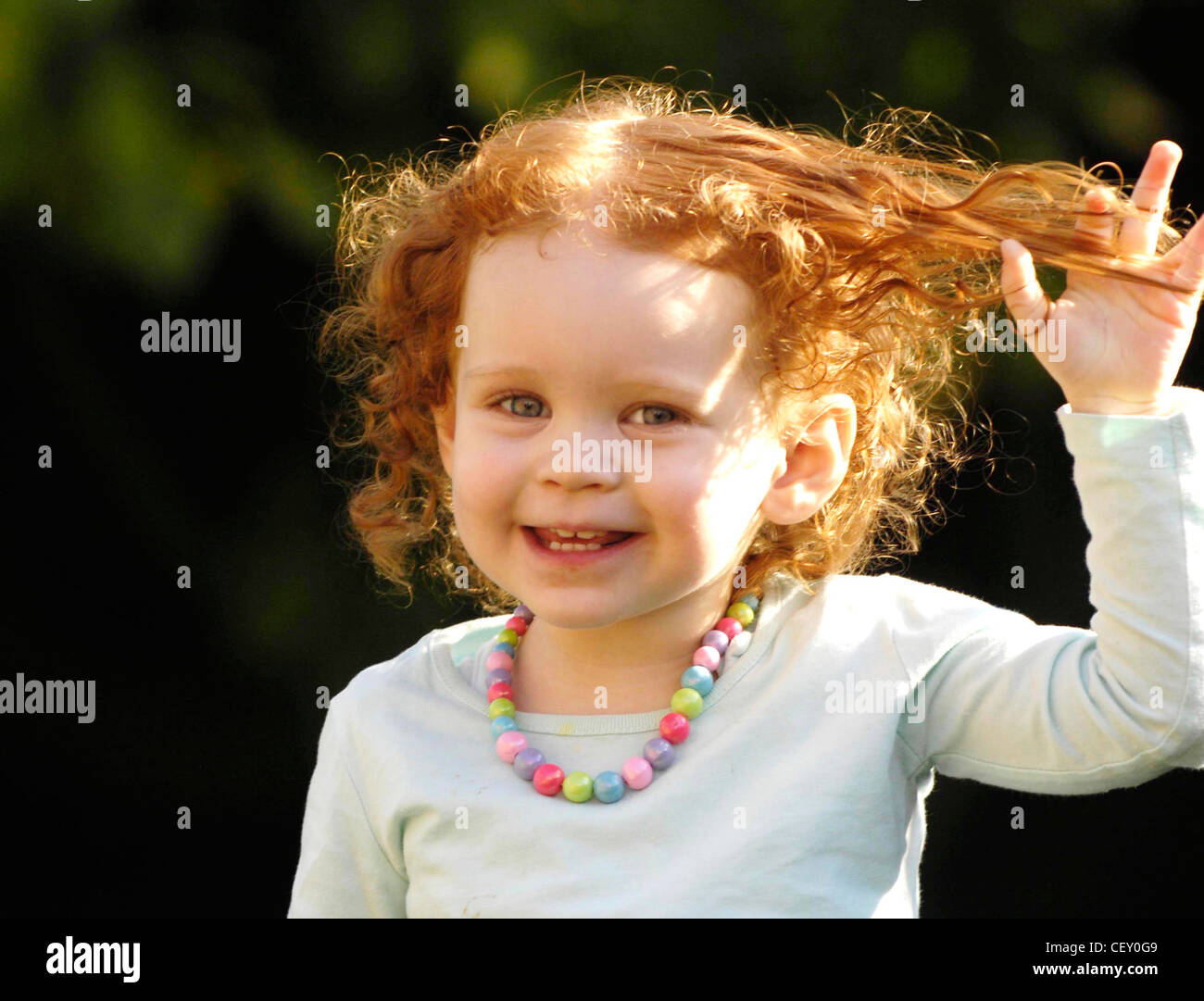 Little Girl With Red Curly Hair