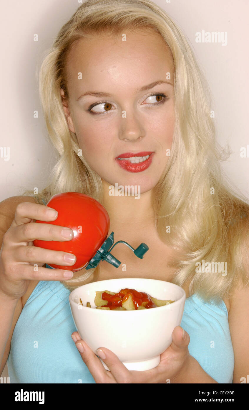 Female Long Blonde Hair Wearing Light Blue Vest Top And Red Lipstick