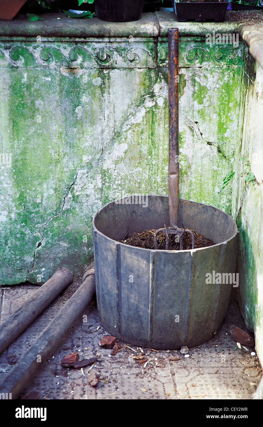 Potting Ideas An old plastic drum does duty as a temporary storage ...