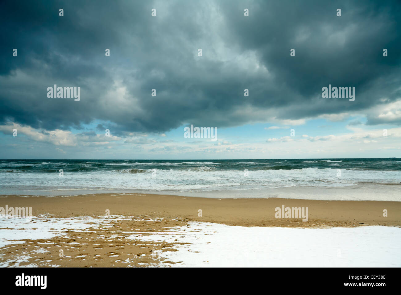 Black sea beach in the winter, with snow on the sand Stock Photo - Alamy