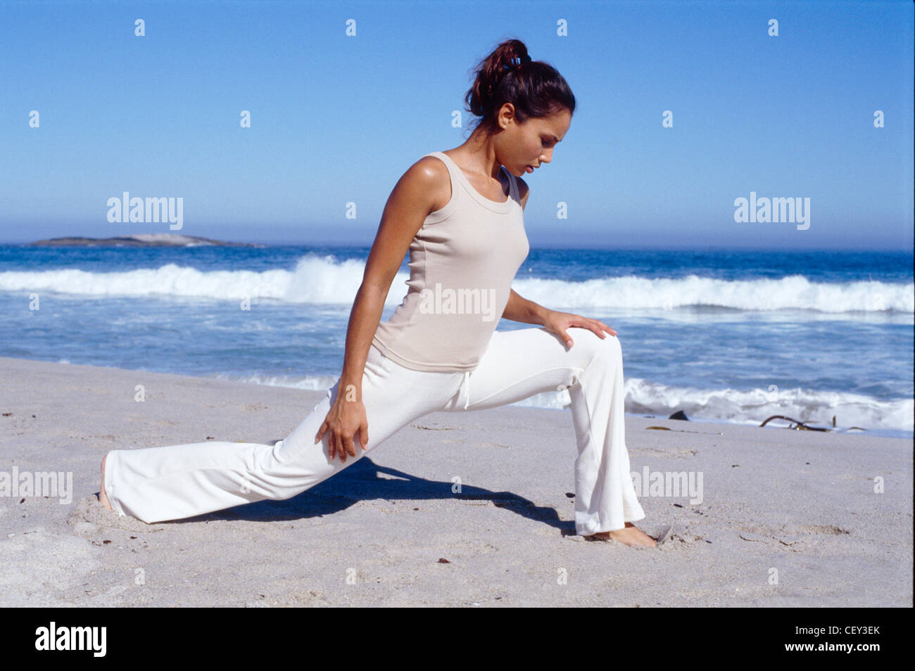 Woman exercise standing legs wide hi-res stock photography and images ...