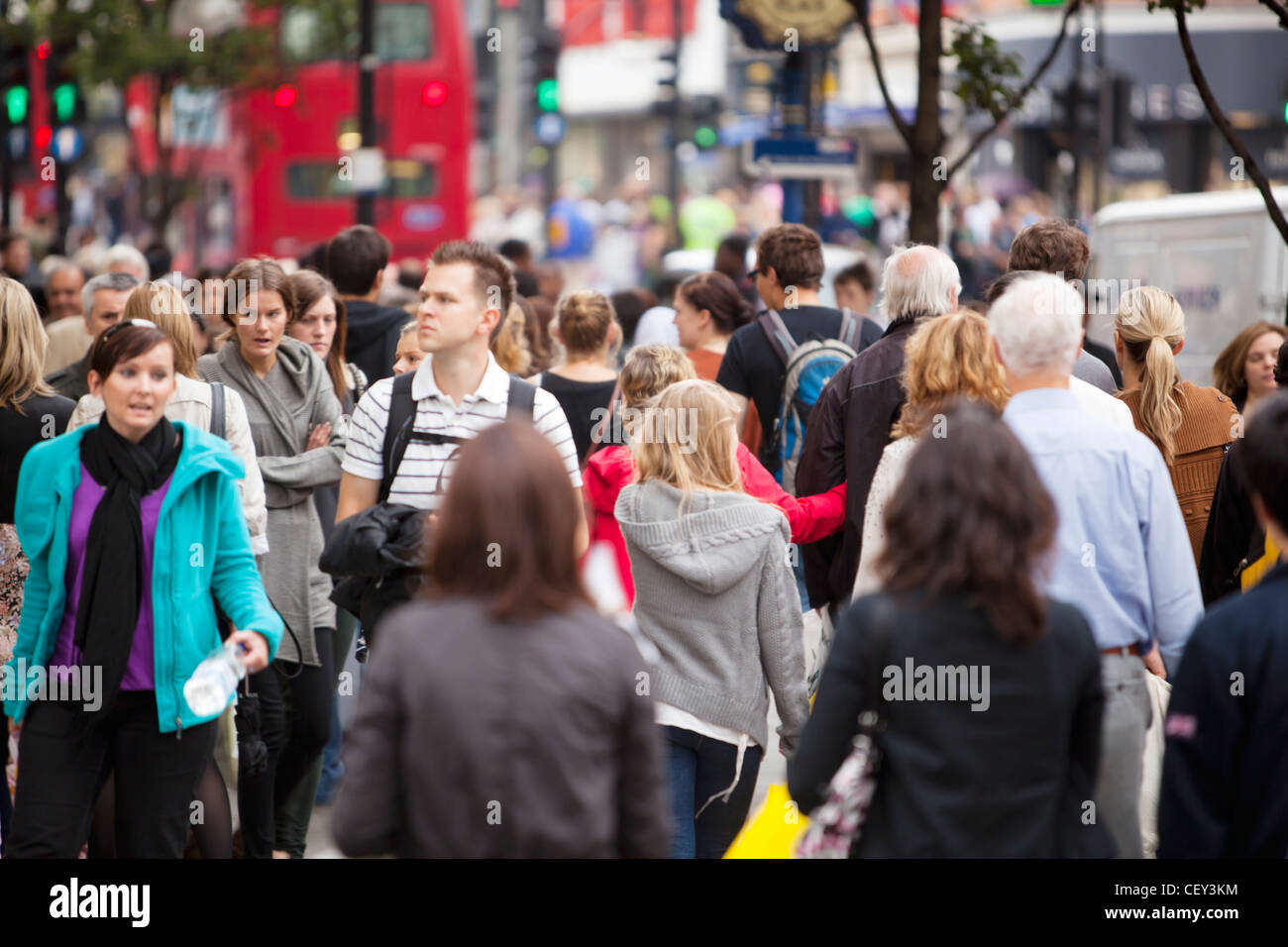 A crowd of people moving up and down Oxford Streeet on a busy Saturday ...