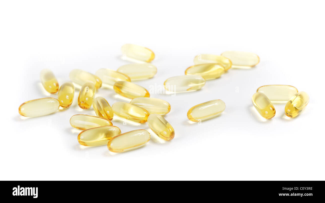 Transparent yellow cod-liver pills on a white background Stock Photo ...