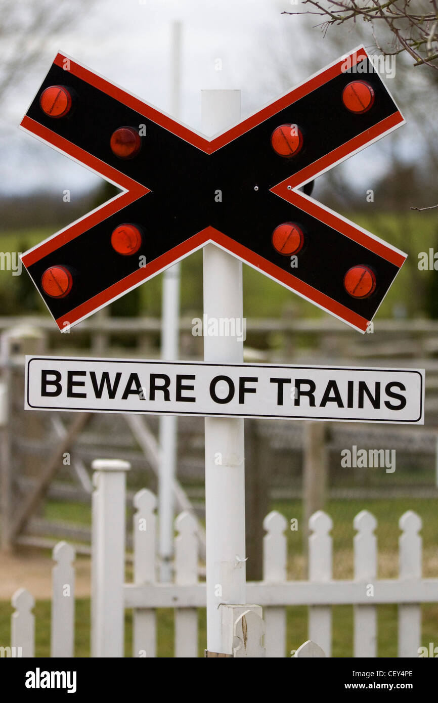 A Beware of oncoming trains sign Stock Photo - Alamy