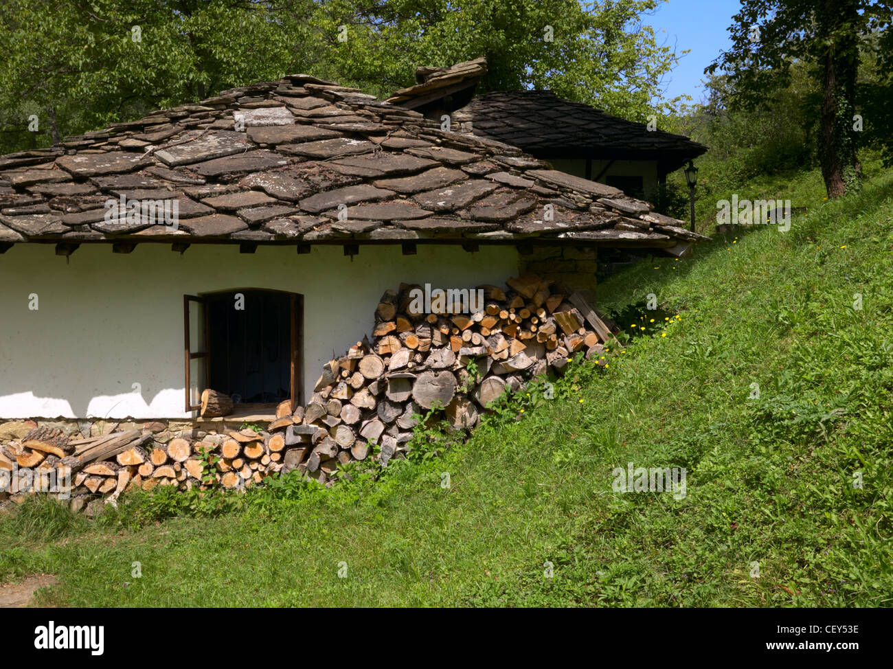 Old traditional house with stone-tiled roof Stock Photo - Alamy