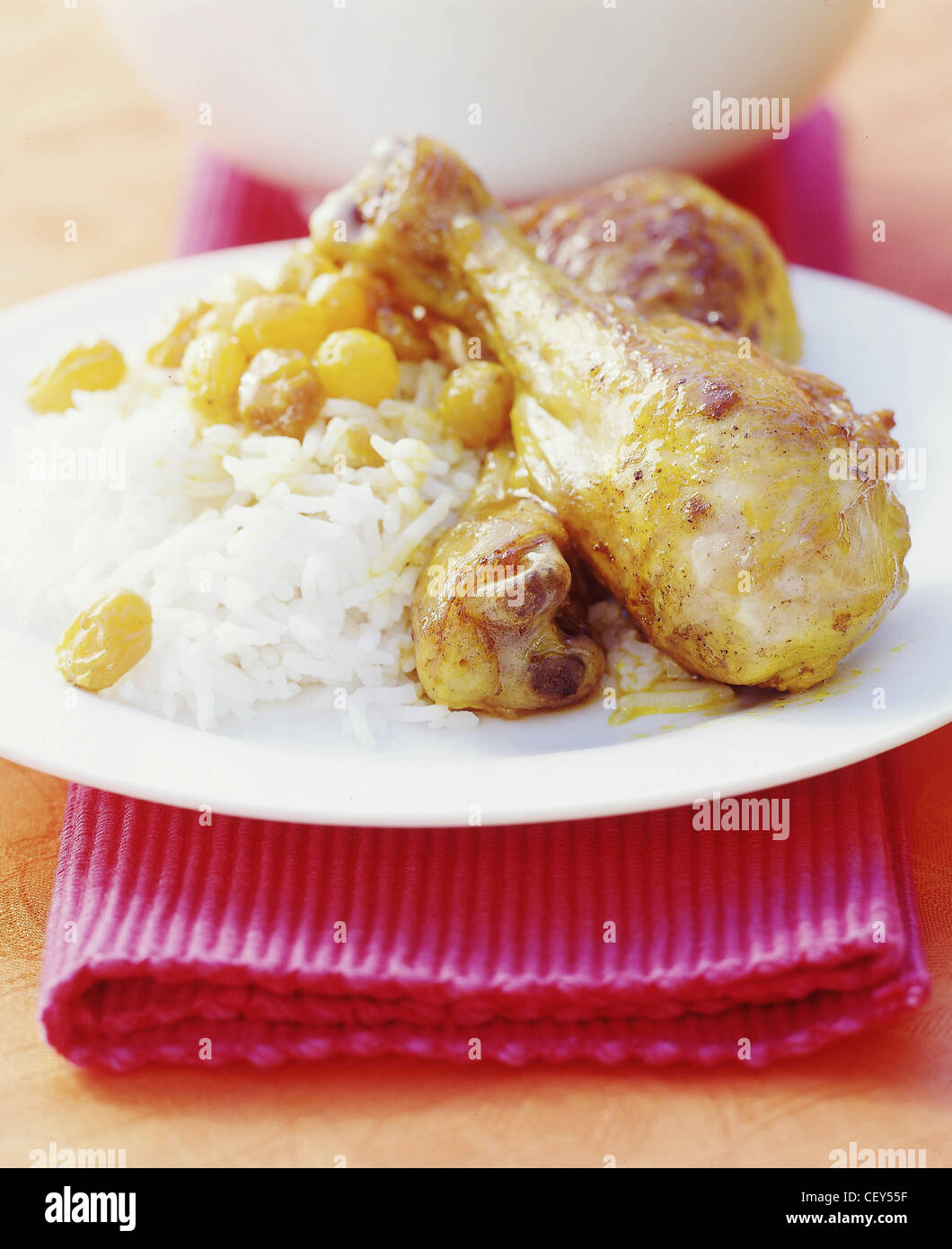 "Flavours from Irene" Orange chicken curry with sultanas on rice Stock ...