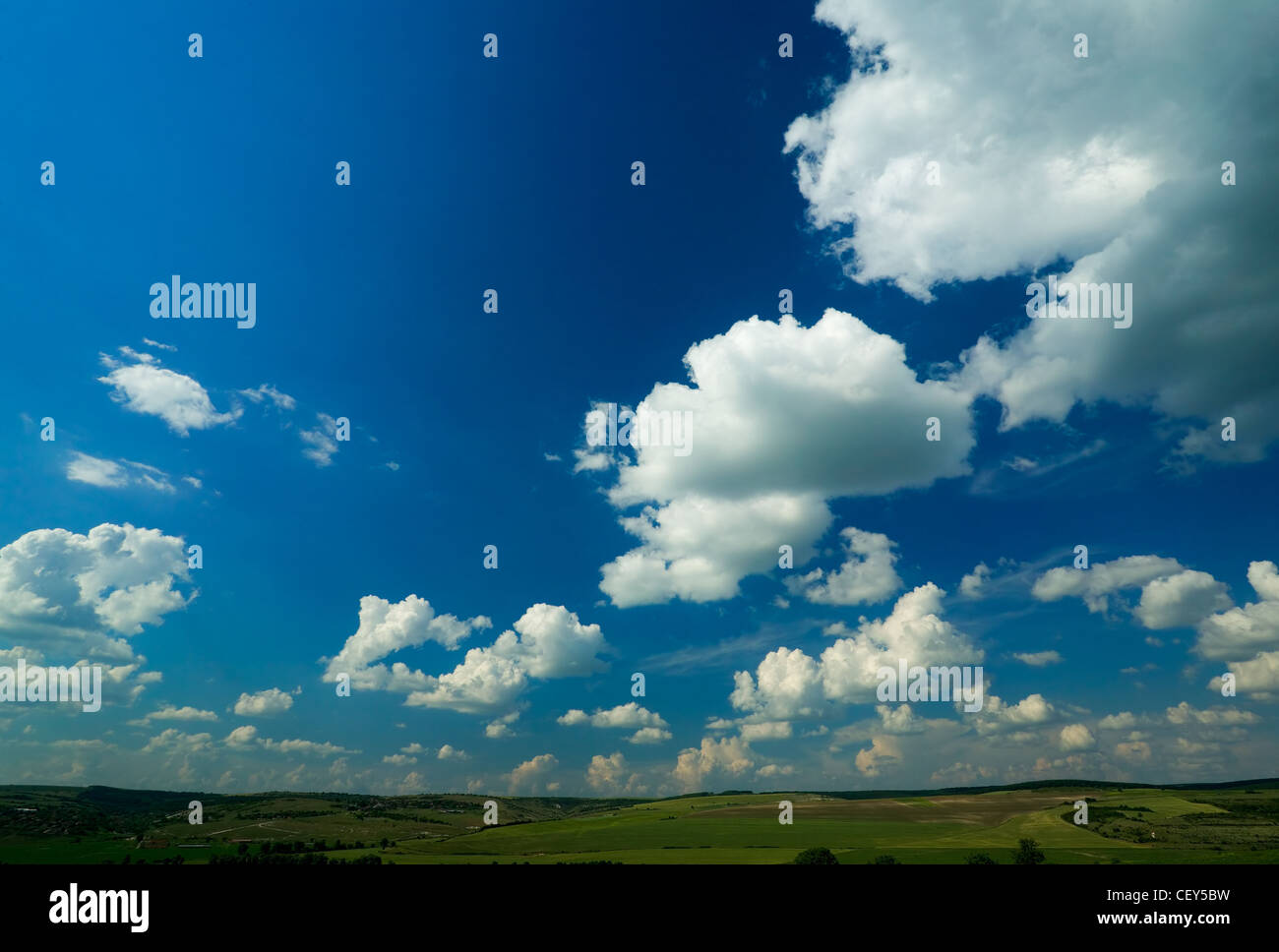 Landscape and deep blue cloudy sky Stock Photo - Alamy