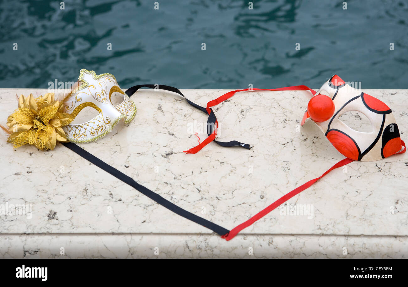 Masquerade mask shaped as a heart Stock Photo - Alamy