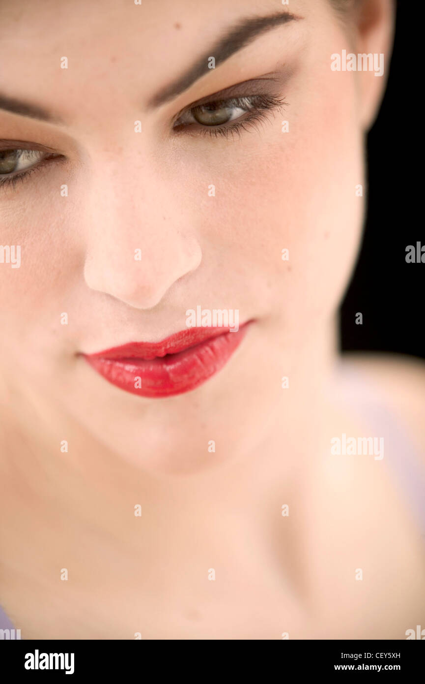 Female with brunette hair off face, brown eyeshadow and red lipstick ...