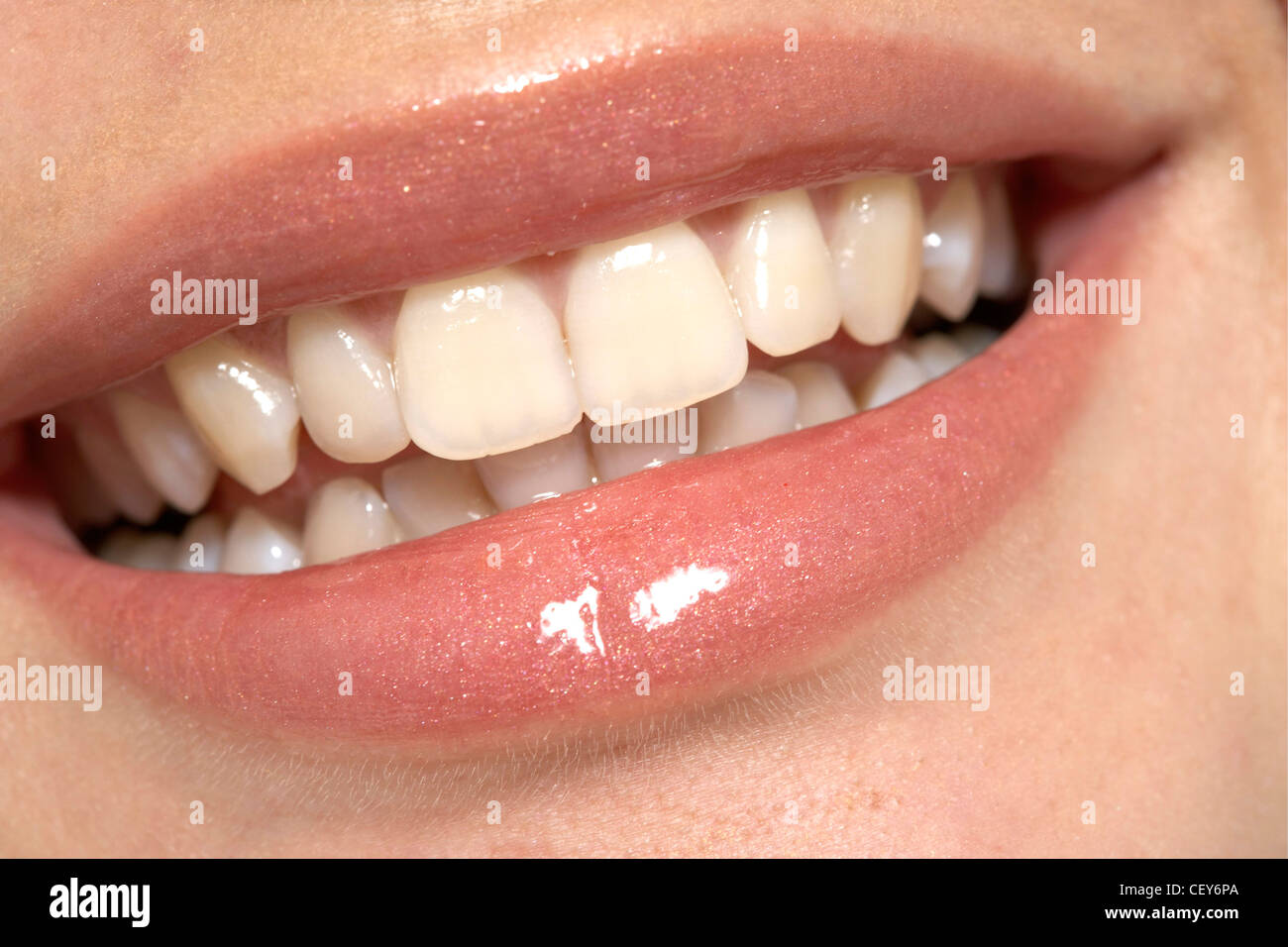 Close up of smiling glossy lips, taken at angle Stock Photo - Alamy