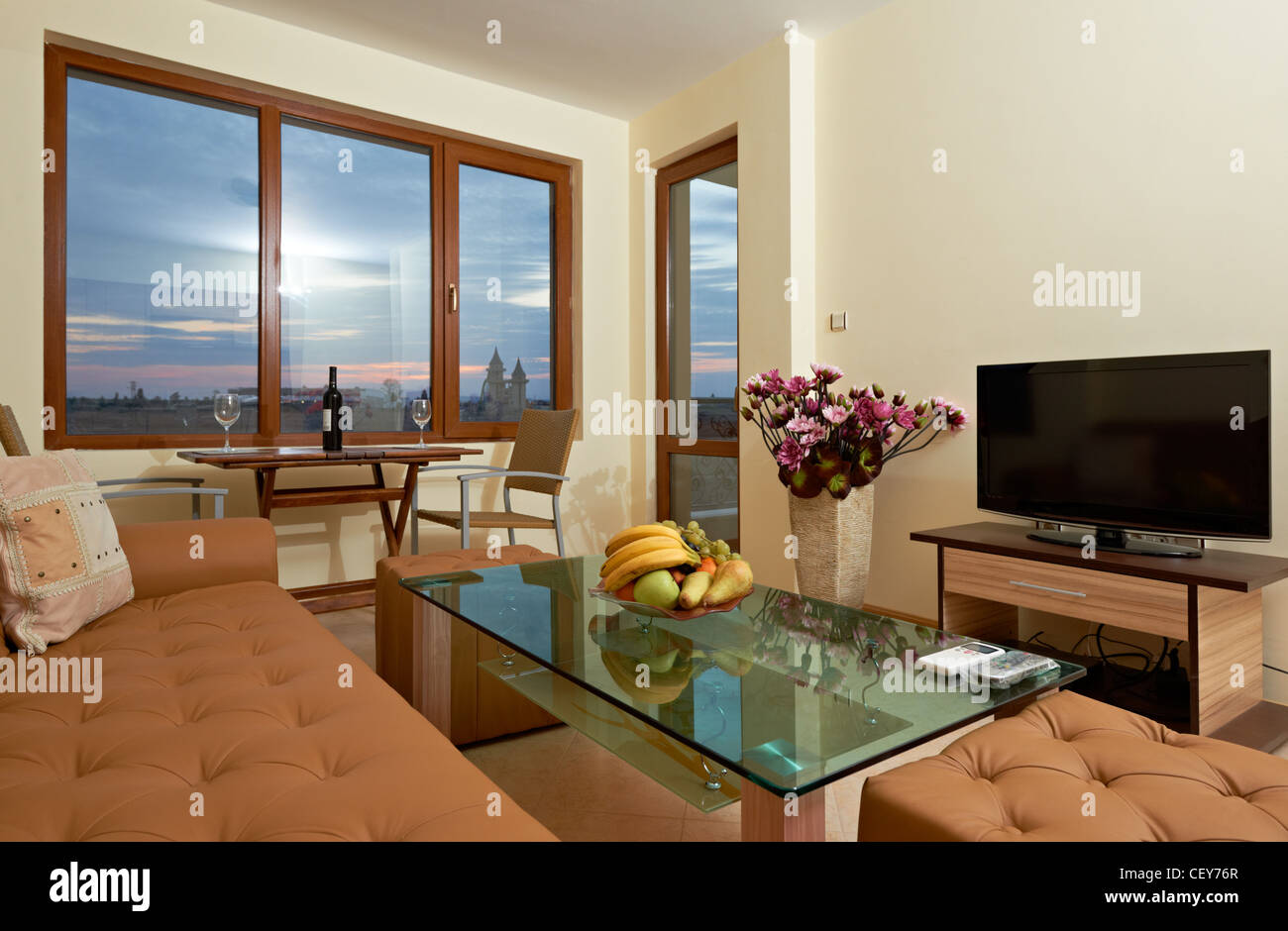 Living room interior with sunset in the window Stock Photo - Alamy