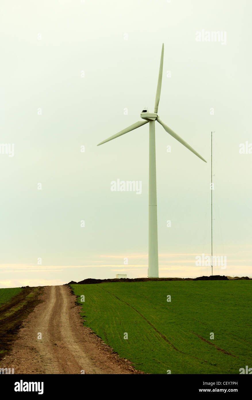 Electric windmill on the horizon at sunset Stock Photo - Alamy