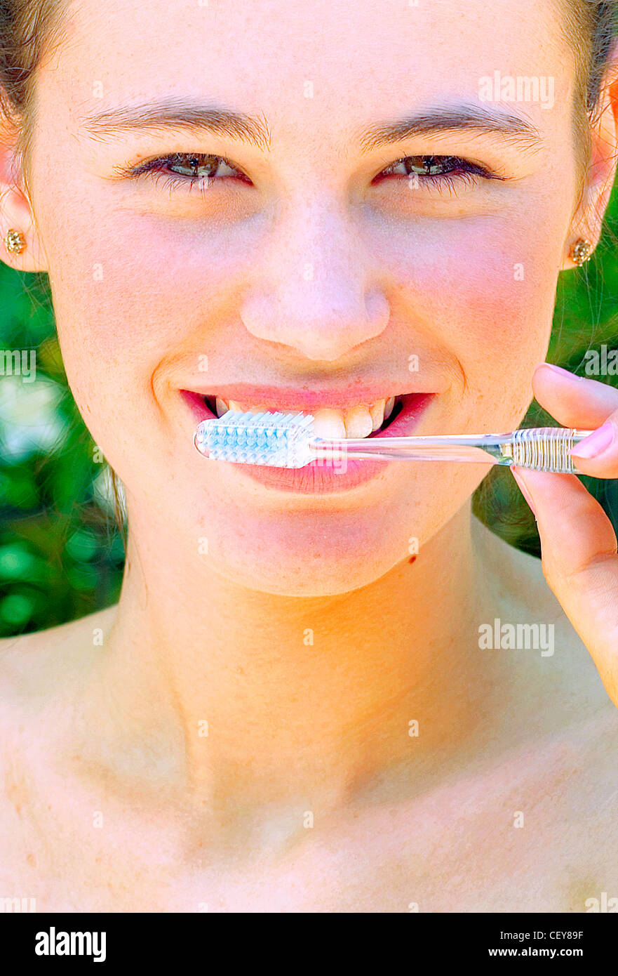 Close up of brunette Female brushing teeth Stock Photo - Alamy