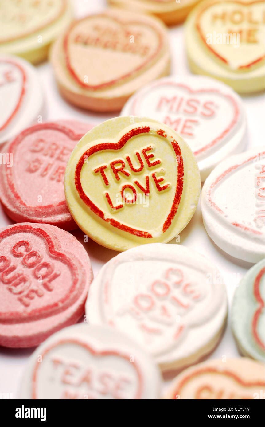 Love Hearts Love hearts on a white background Purple sweets with words ...