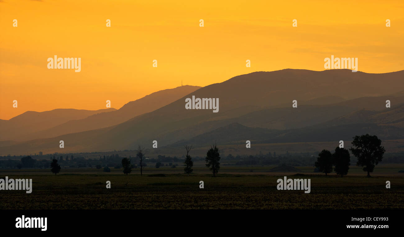 Sunset landscape with beautiful colorful sunset light over mountain ...