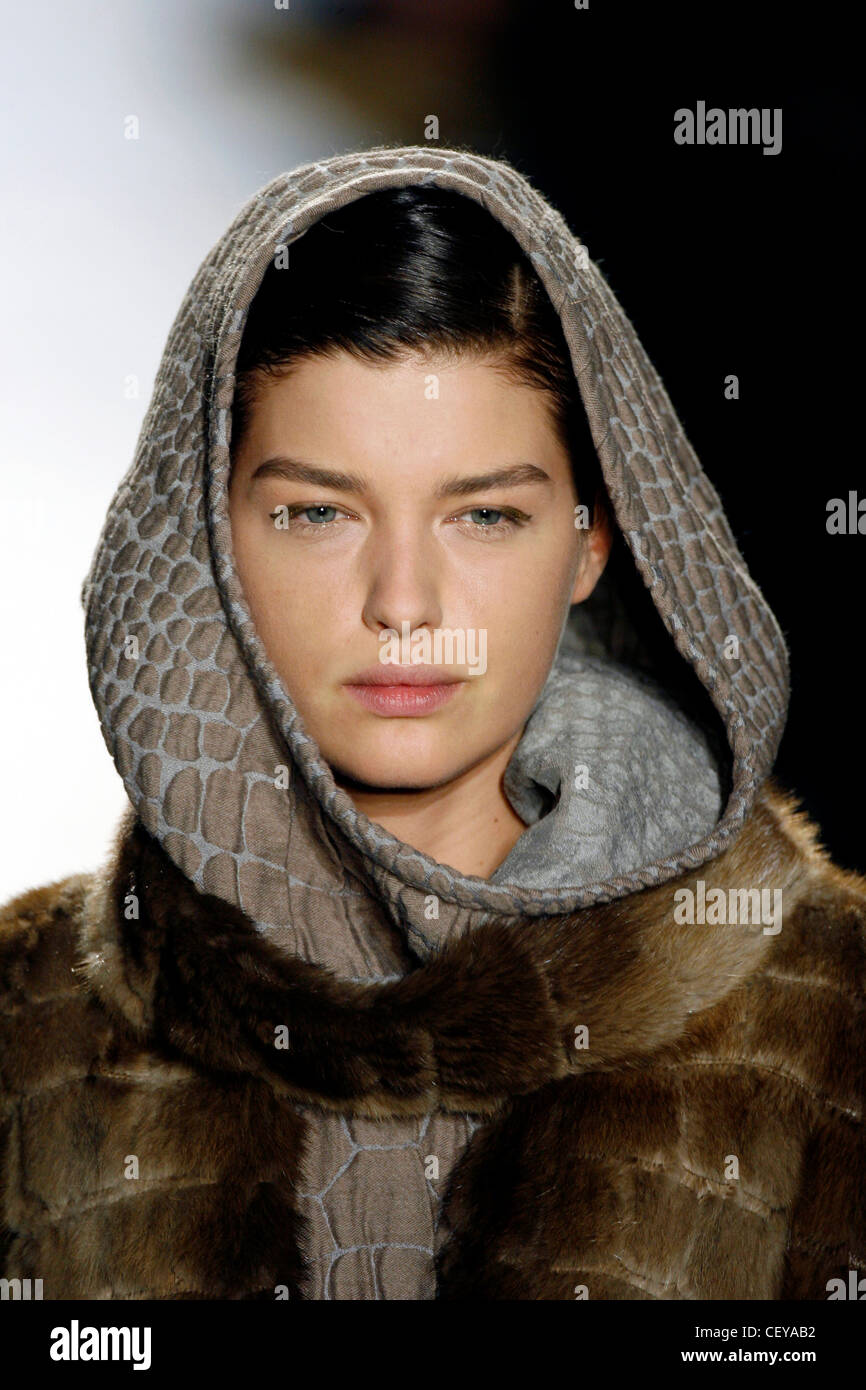 Head and shoulder of female wearing spotted grey hooded top and fur ...