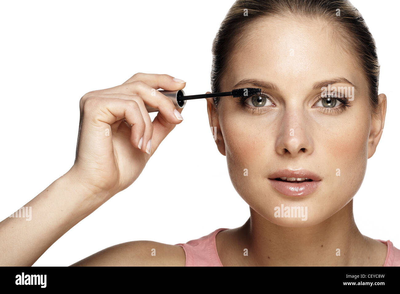 Female applying mascara Stock Photo - Alamy