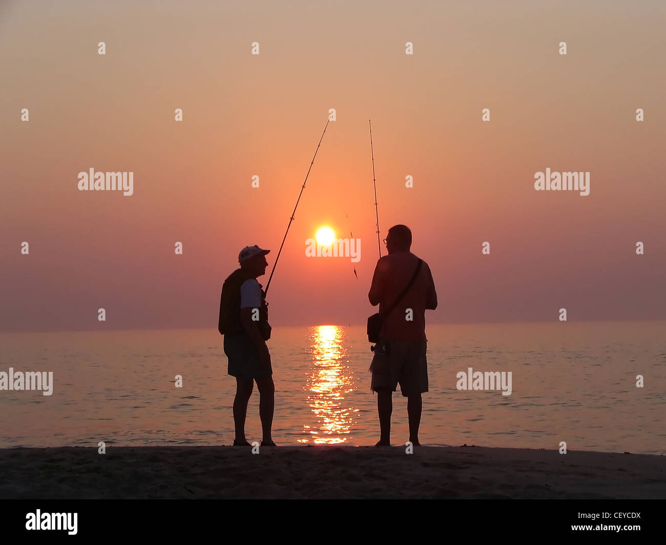 Friends fishing. Free space for text available Stock Photo - Alamy