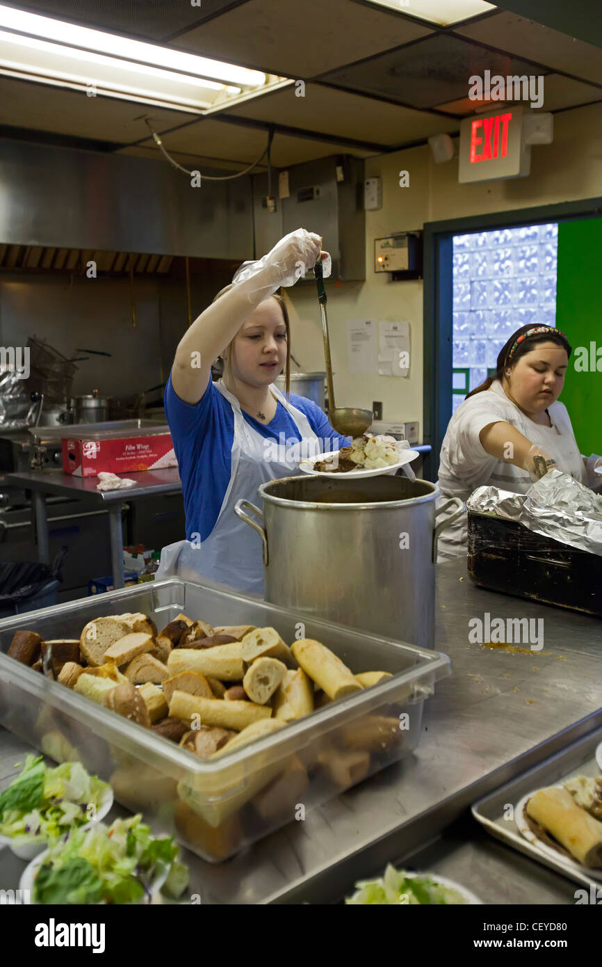 High School Volunteers Serve Dinner at Rescue Mission Shelter Stock ...