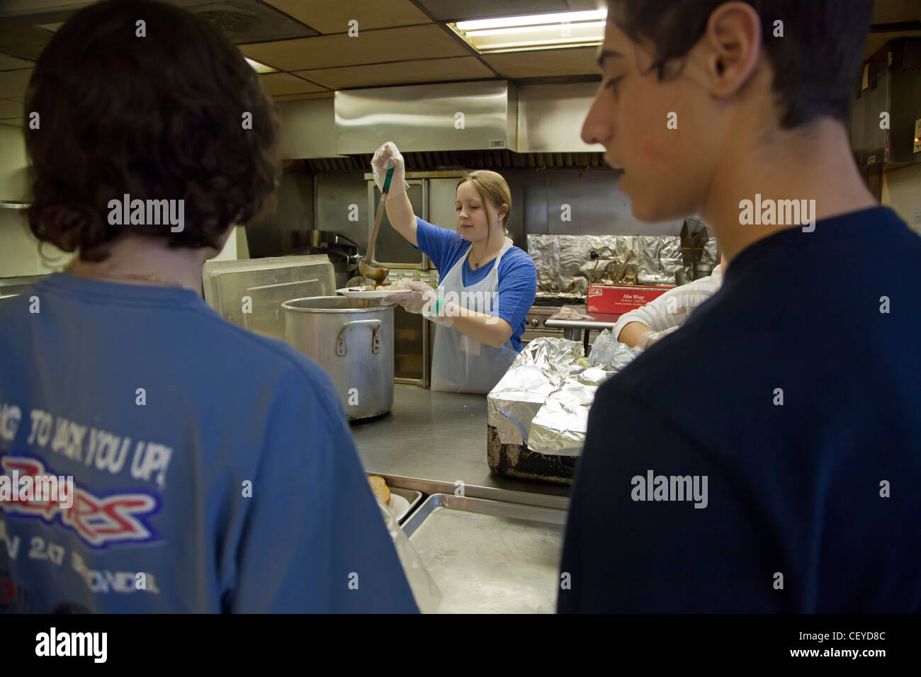 High School Volunteers Serve Dinner at Rescue Mission Shelter Stock ...