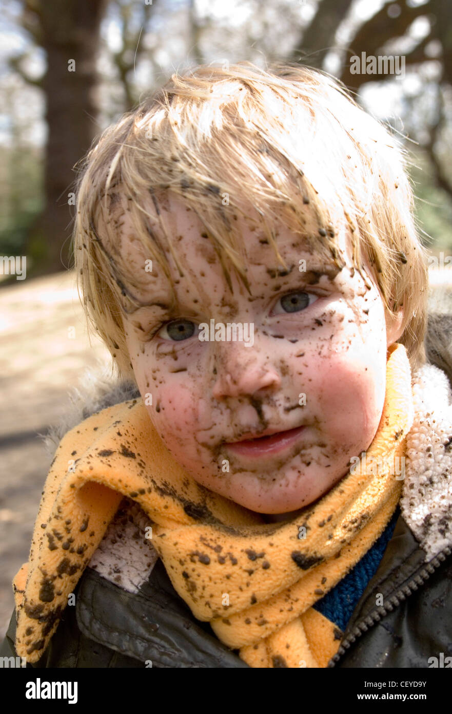 A male child with mud splattered over his face Stock Photo - Alamy