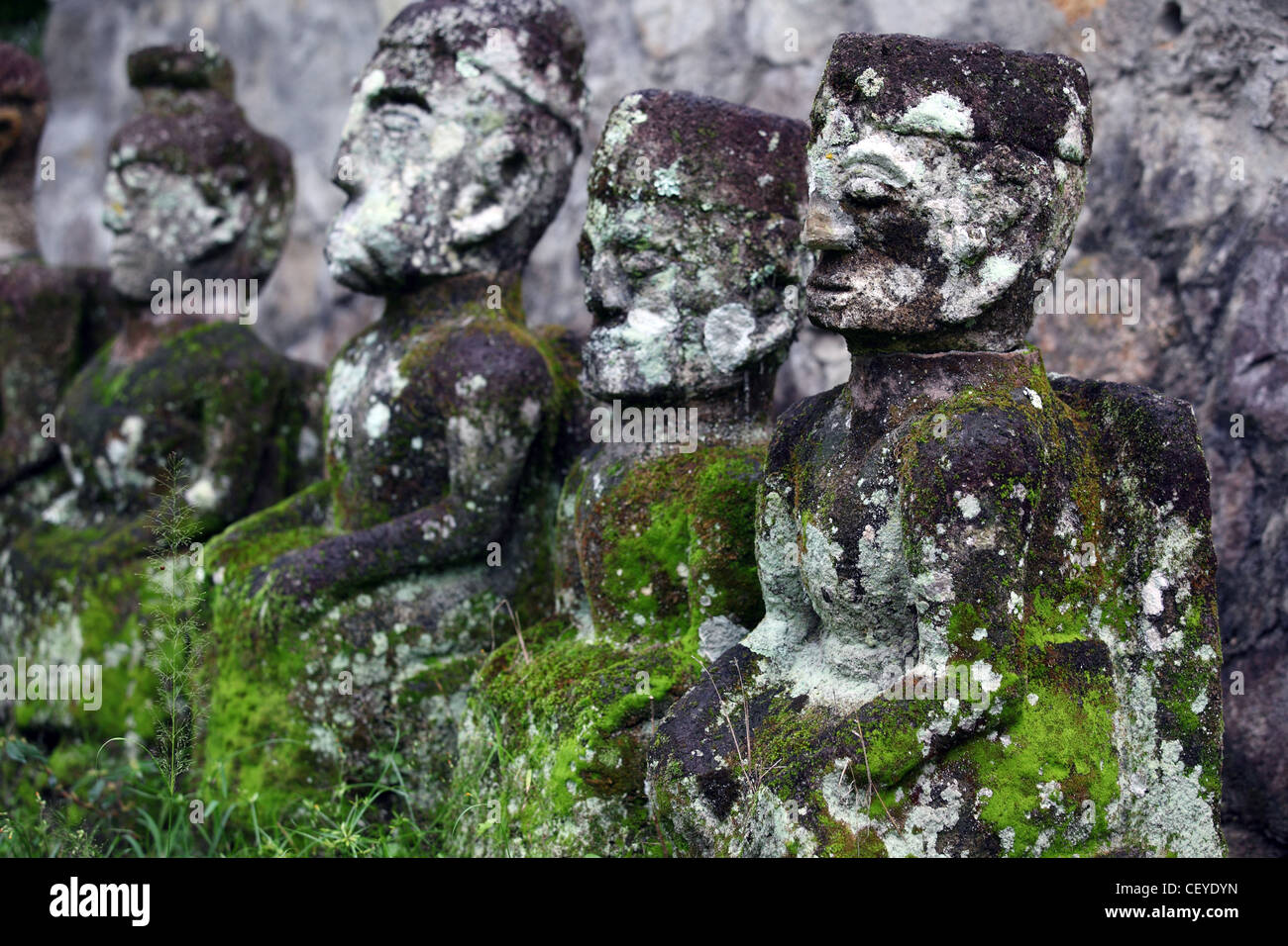 Stone Batak statues near King's grave at Tomok. Samosir Island, Lake ...