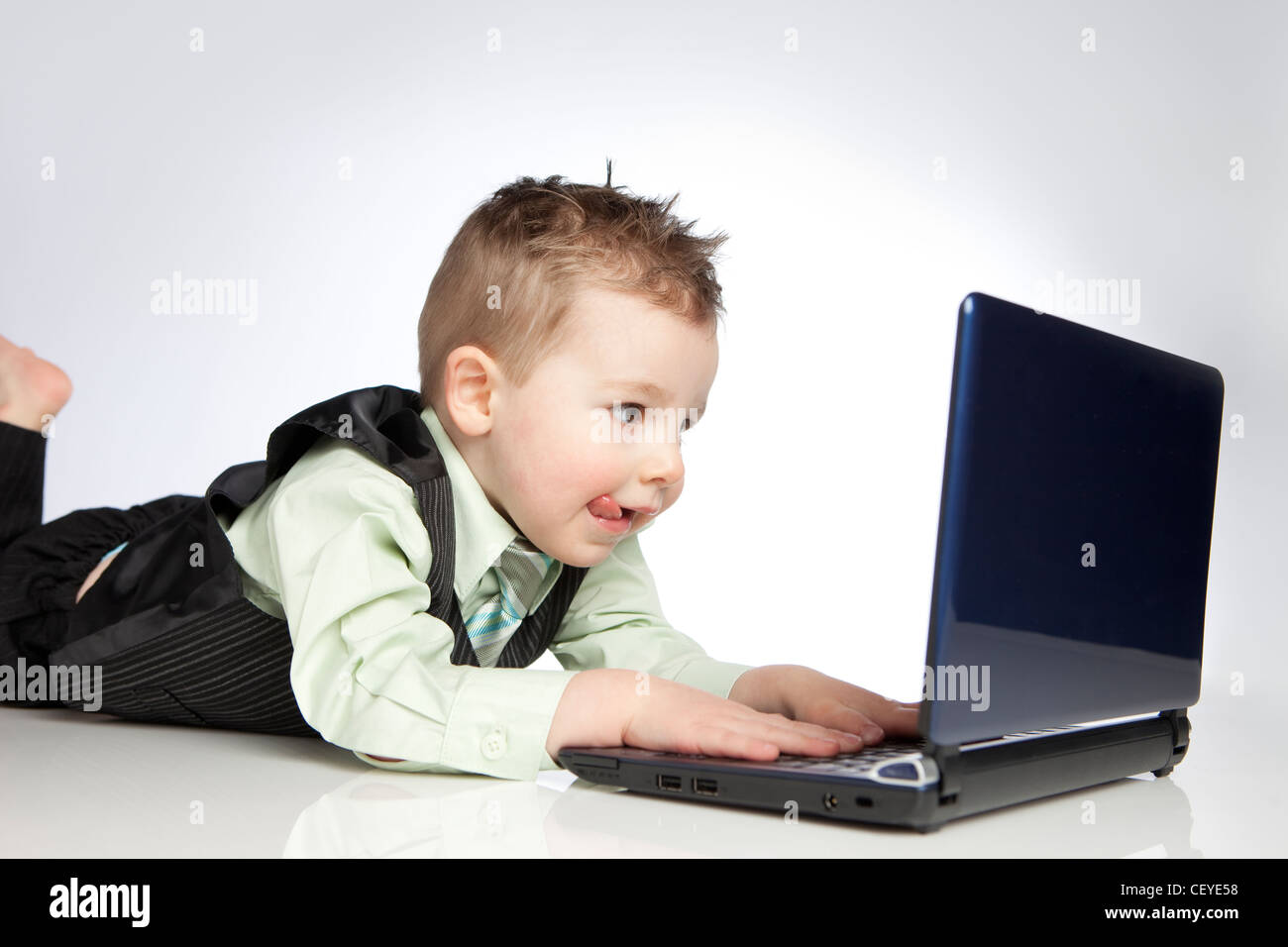 a young boy uses a laptop computer; edmonton alberta canada Stock Photo ...