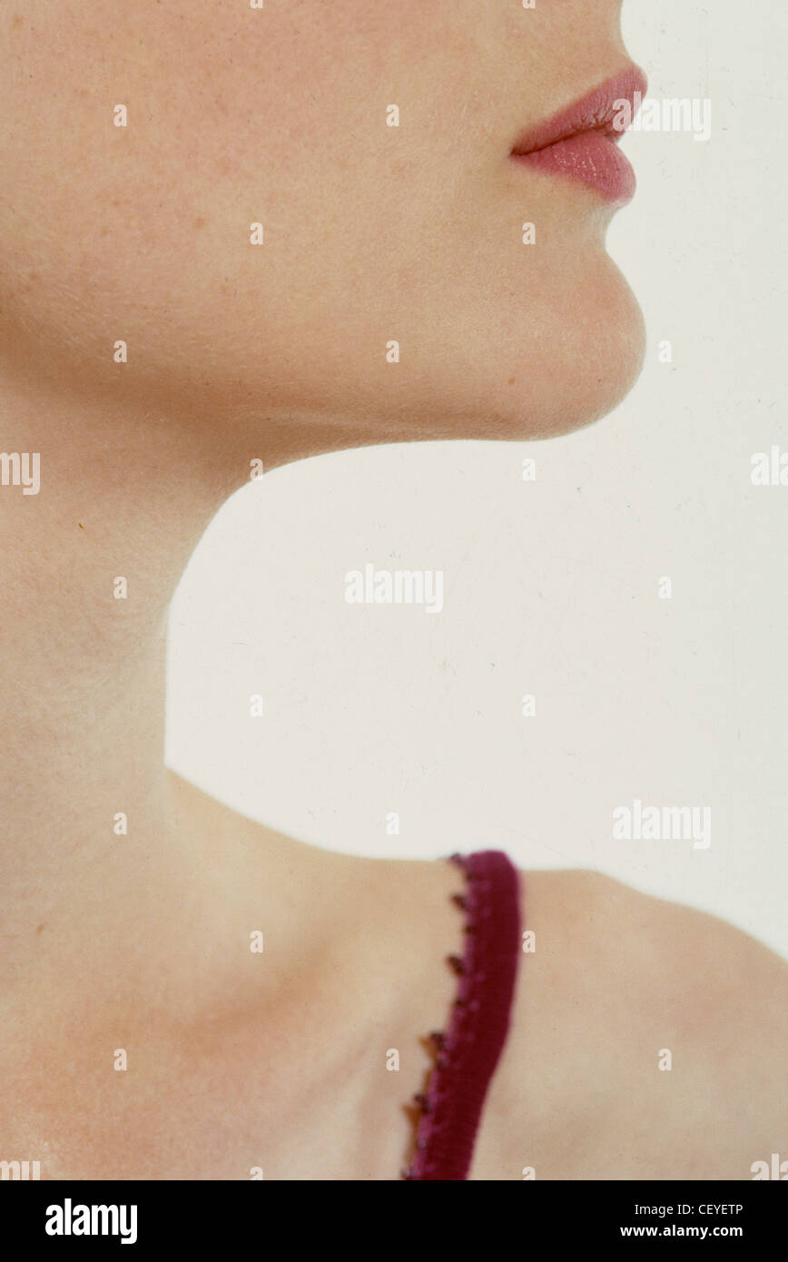 A close up image of cropped female's face, wearing pink lipstick ...