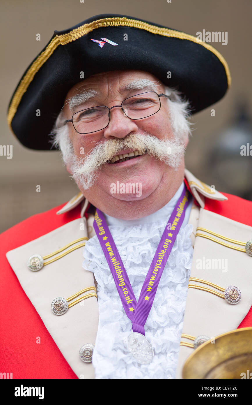a traditional english town crier cryer in uniform Stock Photo - Alamy