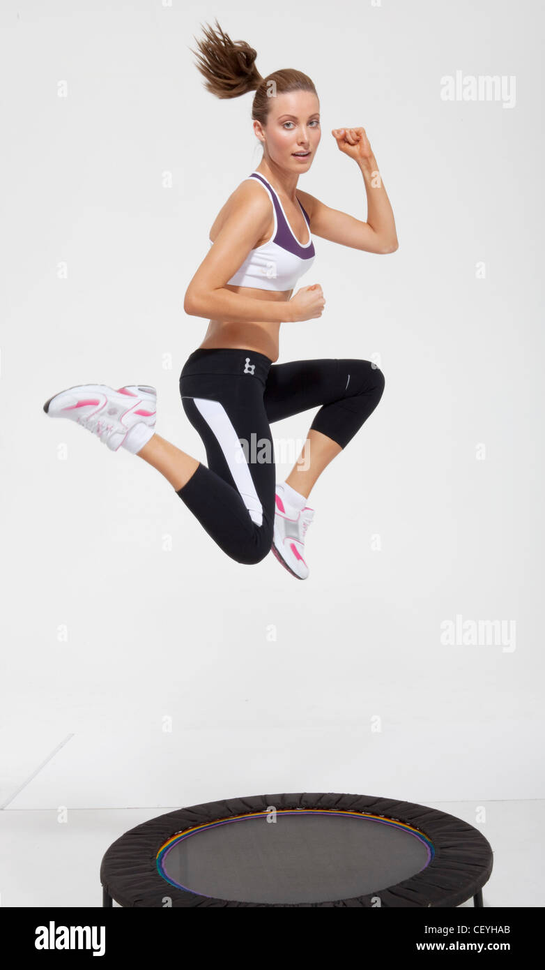 Female fair hair tied into ponytail, wearing a cropped vest, black ...