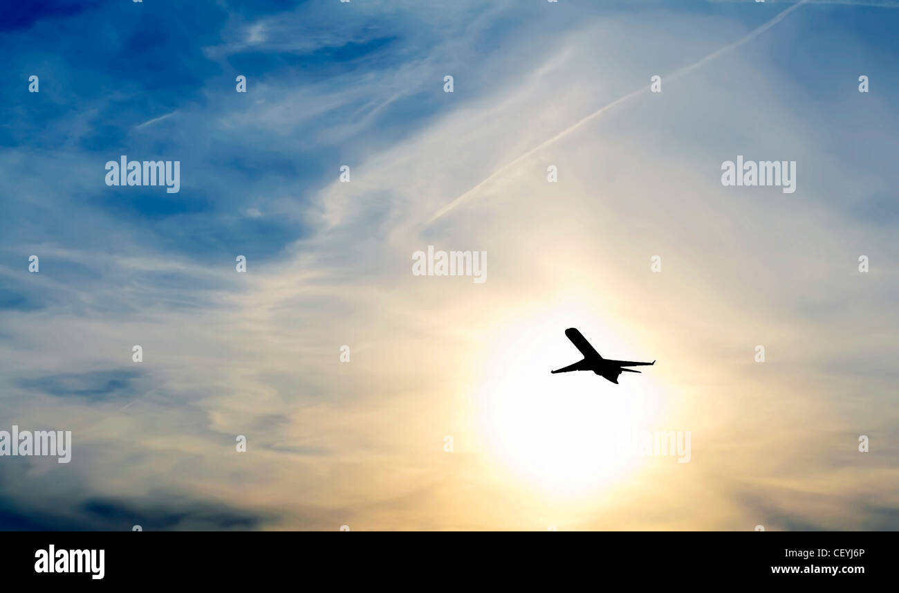 Plane flying clouds sunset sky hi-res stock photography and images - Alamy