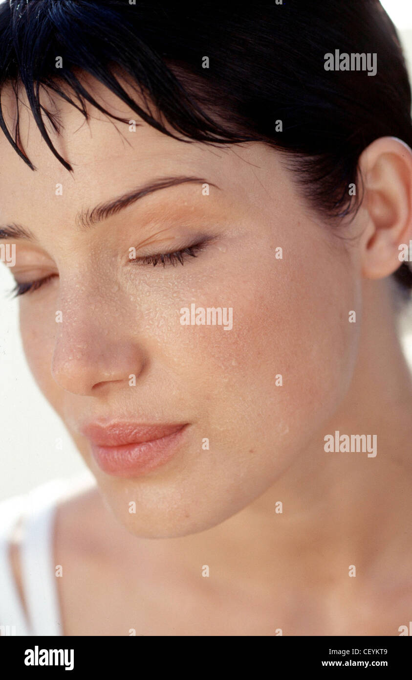 Female wet black hair and short fringe wearing lipgloss natural eye ...