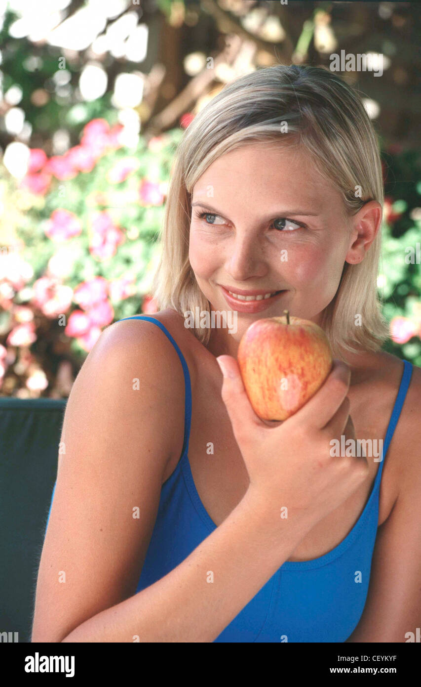 Tanned Female With Chin Length Blonde Hair Wearing Subtle Make Up And