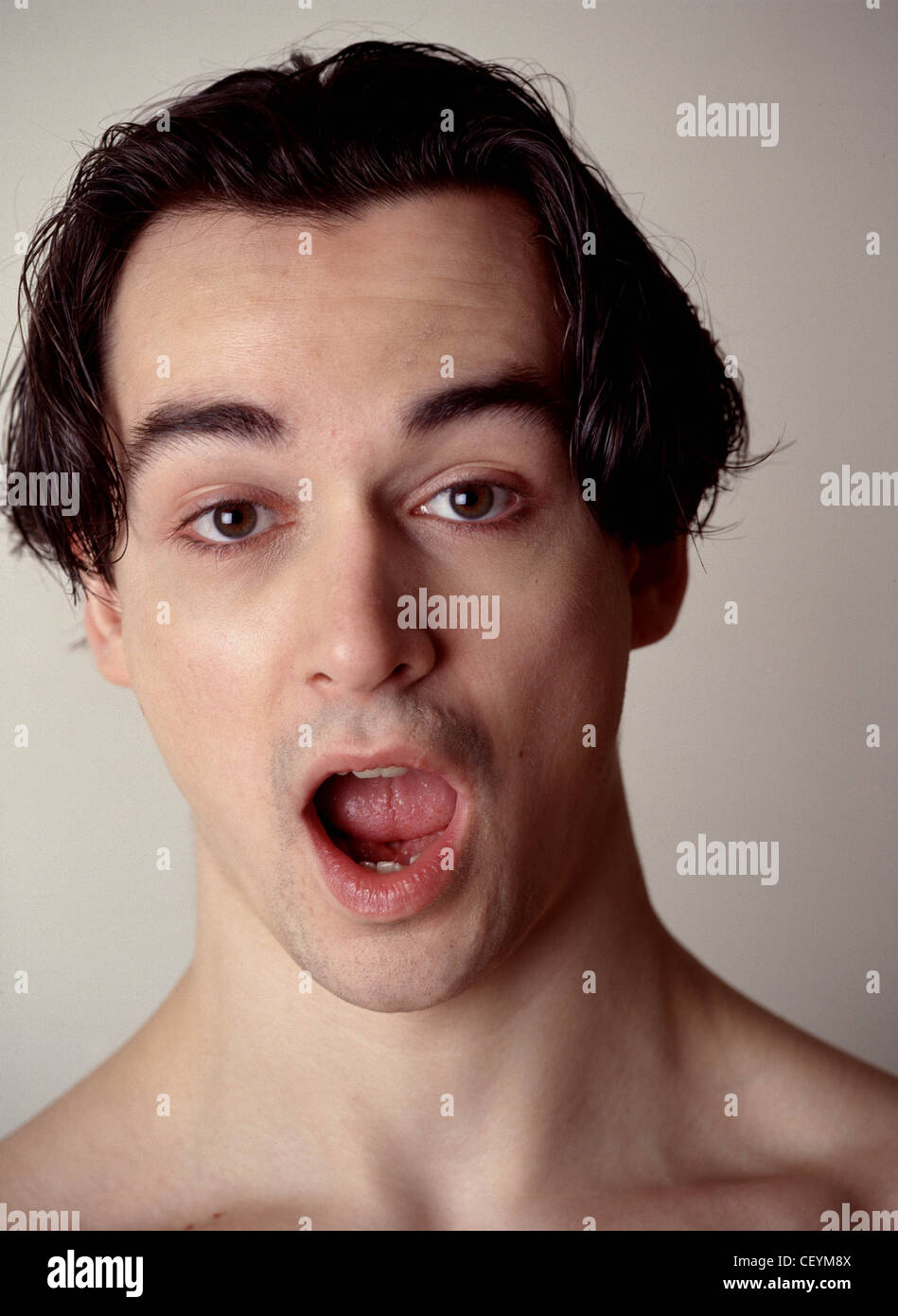 Male medium length brown hair heavy eyebrows raised bare shoulders ...