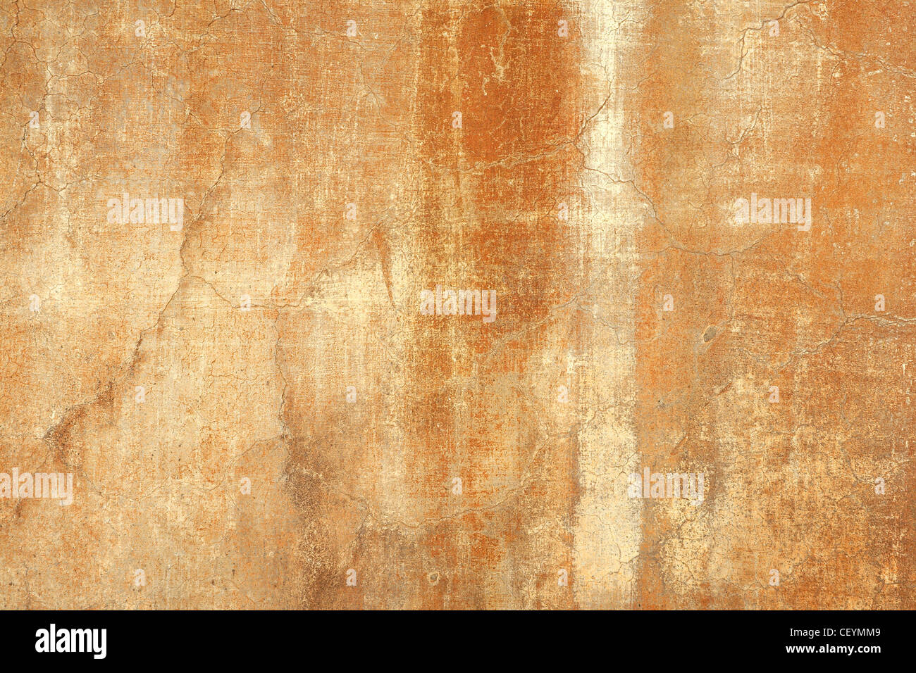 close detail of beautifully textured ochre stucco weathered by time ...