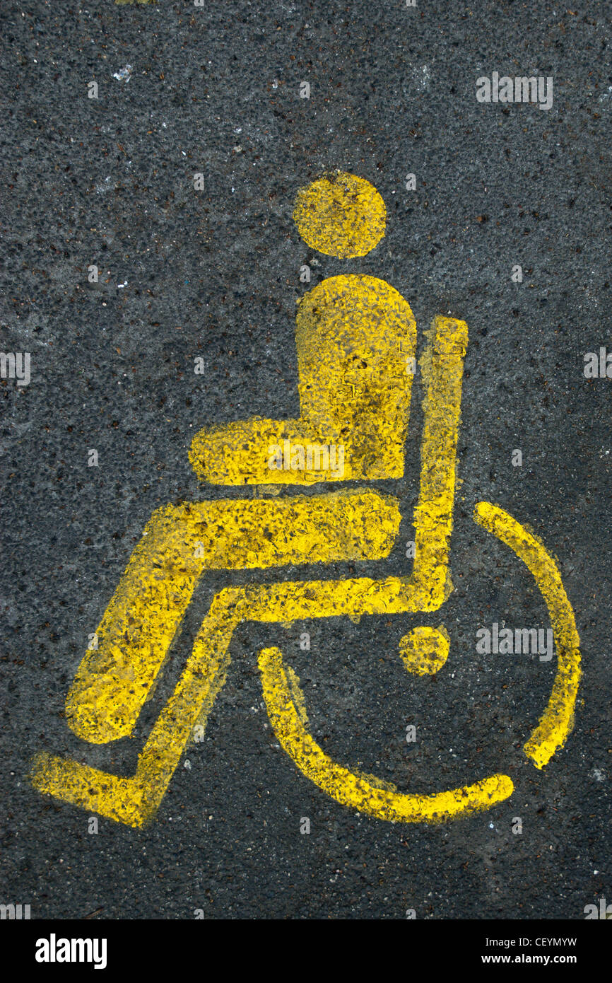 wheelchair sign painted on disabled parking space Stock Photo - Alamy