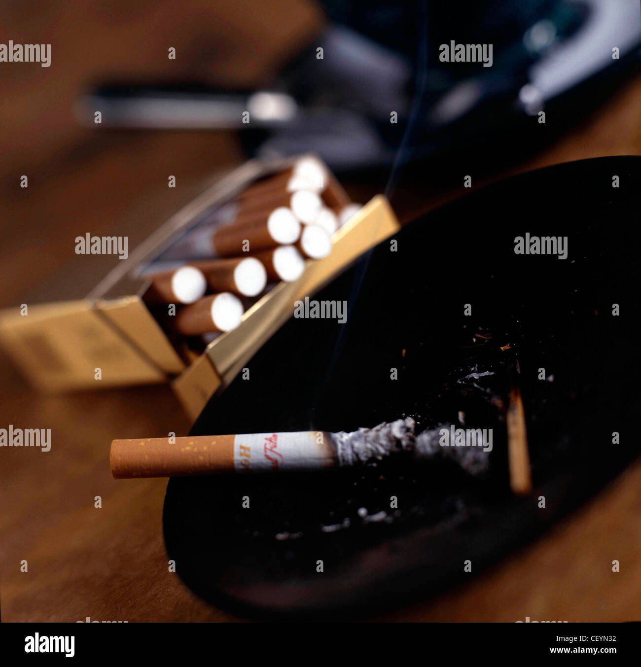 Lit cigarette hi-res stock photography and images - Alamy