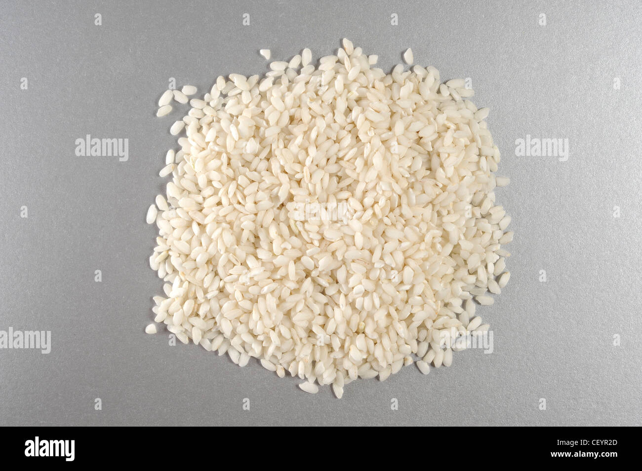 A small pile of short grain arborio risotto rice Stock Photo - Alamy