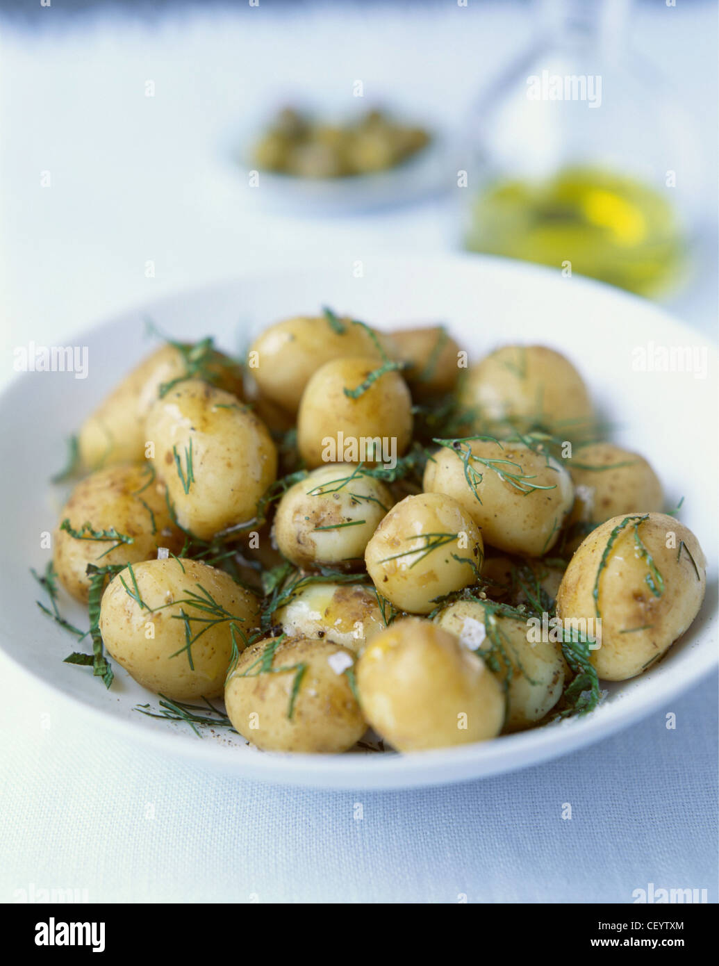 A bowl of boiled new potatoes with sea salt and fresh Stock Photo - Alamy