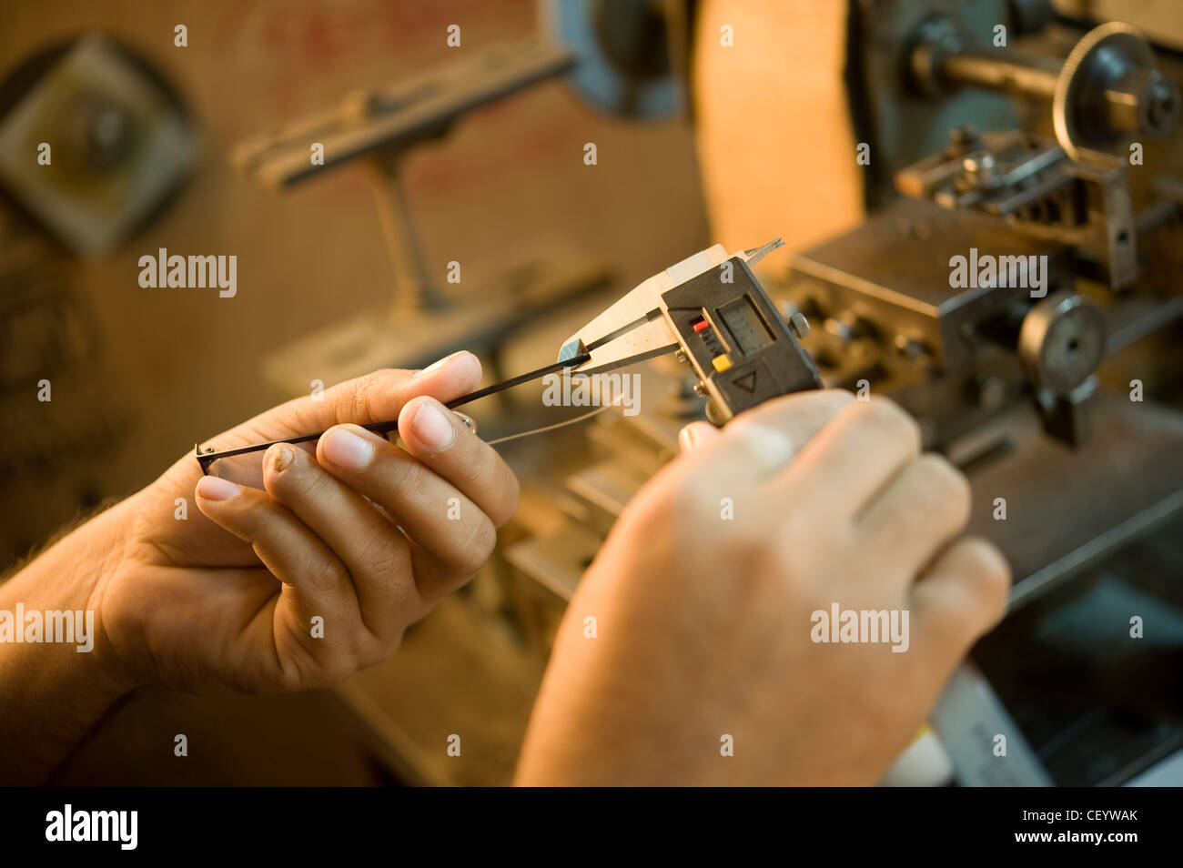 Man settling the frames of a glass by a measuring device Stock Photo ...