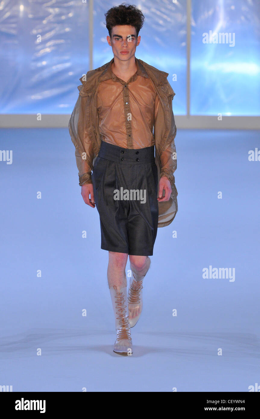Wooyoungmi Paris Menswear Spring Summer Model wearing a beige ...
