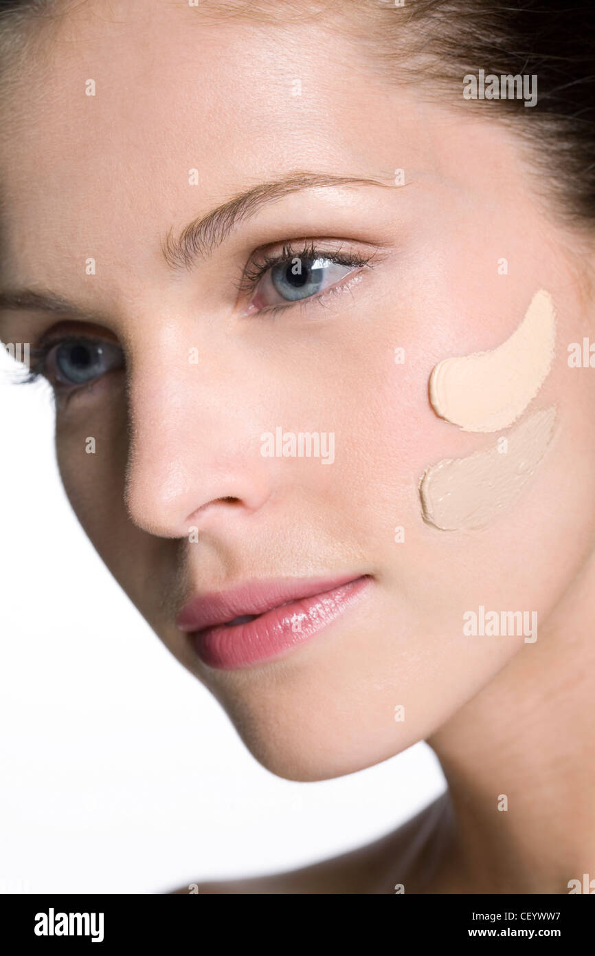 Female wearing natural make up, with two different coloured streaks of ...