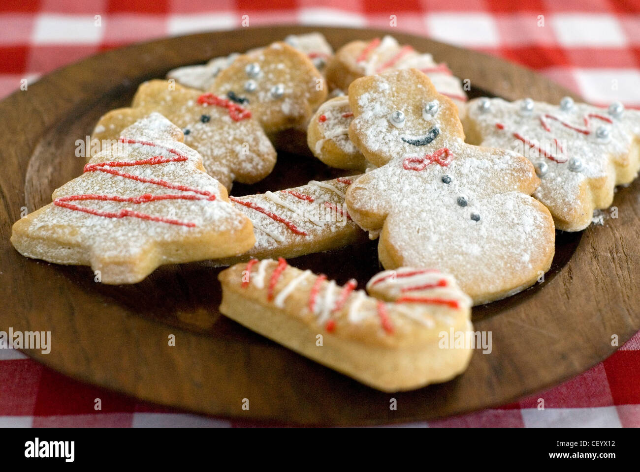 A plate of festive christmas biscuits in the shape of candy canes ...