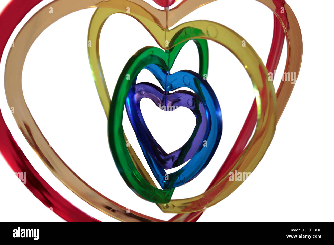 six heart shaped plastic pieces one inside the other on a white ...