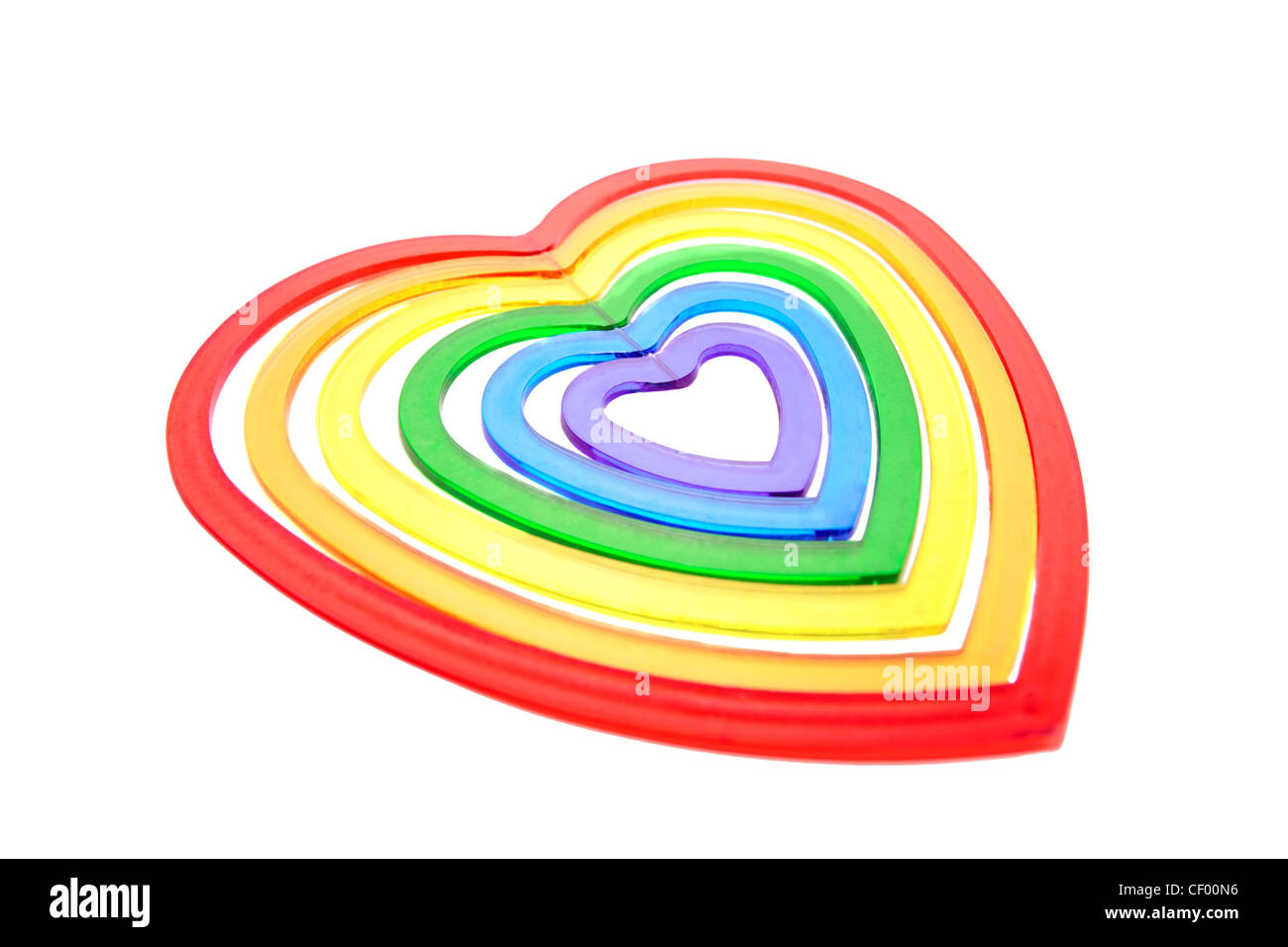 six heart shaped plastic pieces one inside the other on a white ...