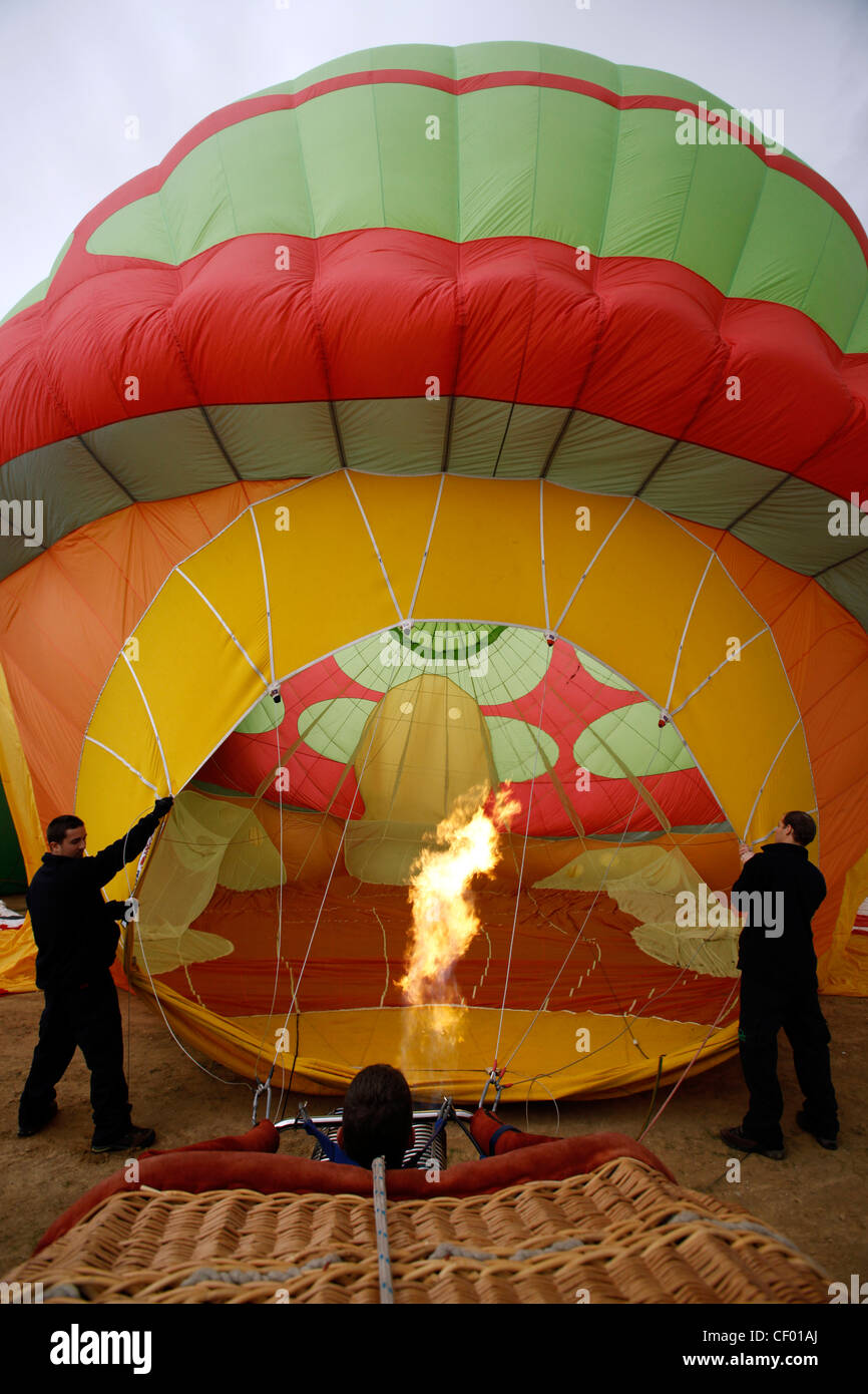 A burner directing a flame into the envelope of a hot air balloon Stock ...