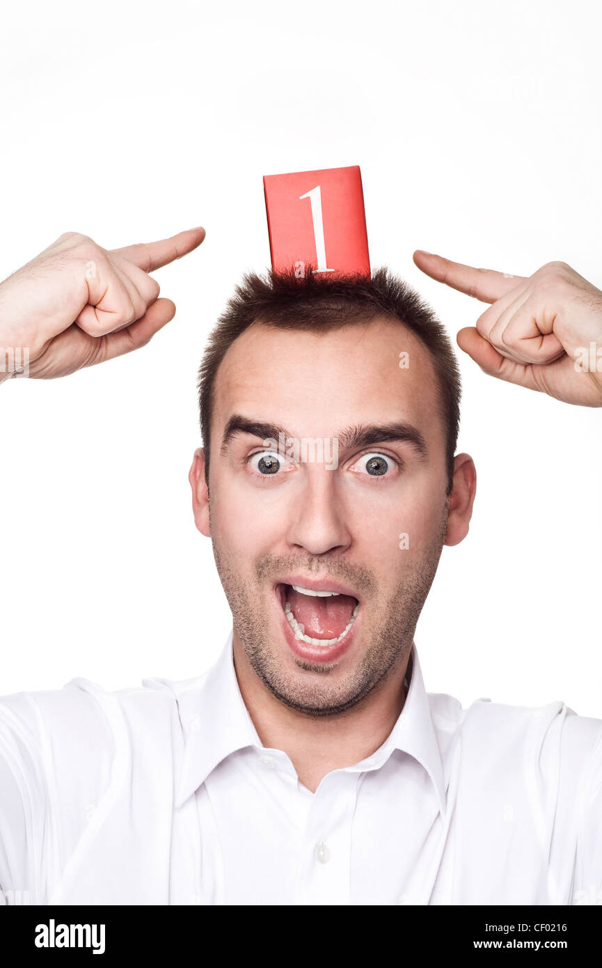 young enthusiastic man pointing his fingers at number one Stock Photo ...
